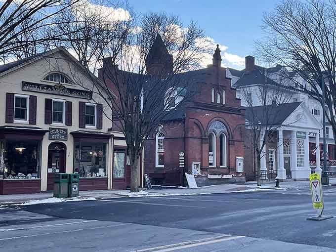 Historic buildings huddle together on Main Street like old friends sharing secrets from centuries past.