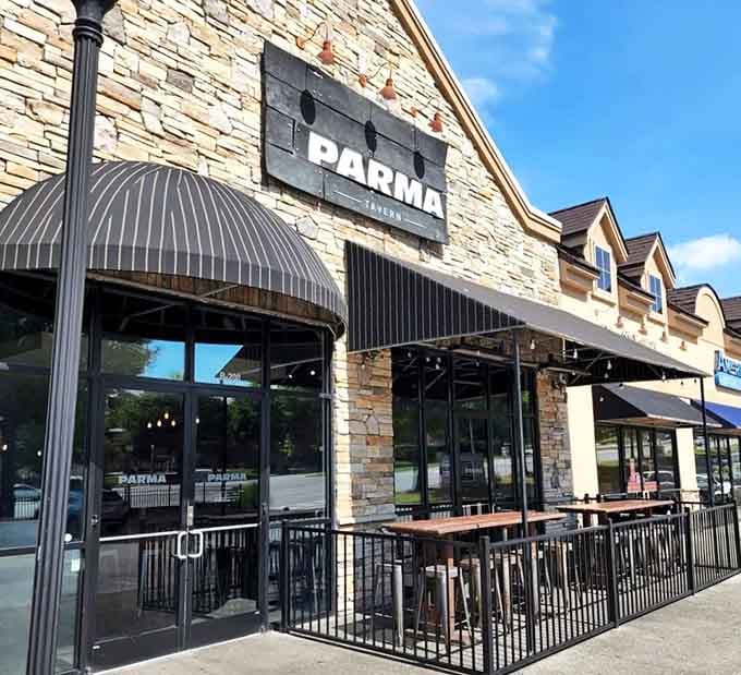 Stone walls and striped awnings signal something worth stopping for at Parma Tavern in Buford, Georgia.