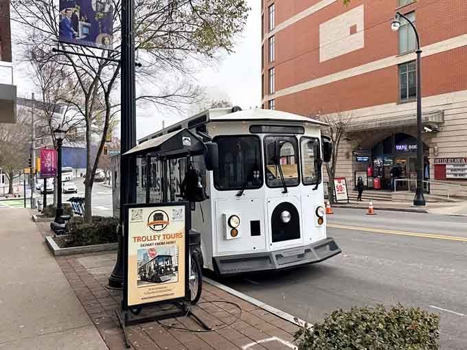 This cheerful white trolley parked on a bustling Atlanta street is basically your city's best-kept secret on wheels.