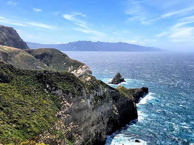 That turquoise water against those rocky cliffs looks like Mother Nature showing off her best work.