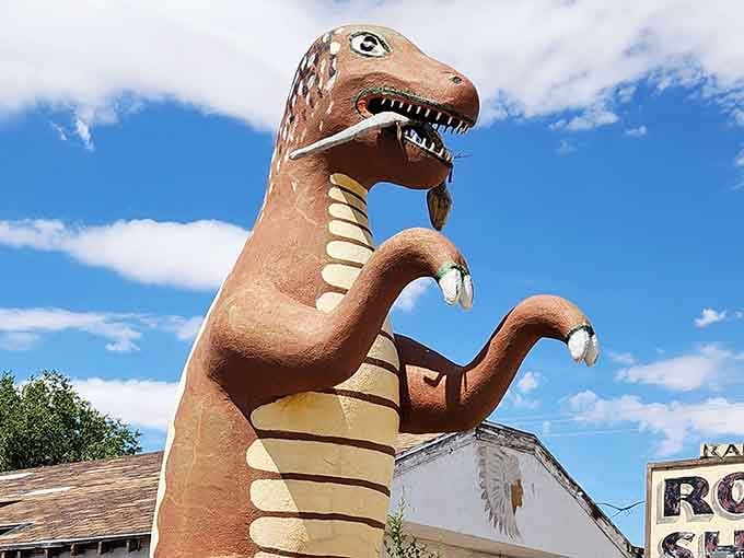 Giant dinosaur standing guard over a rock shop on Route 66, because why not?