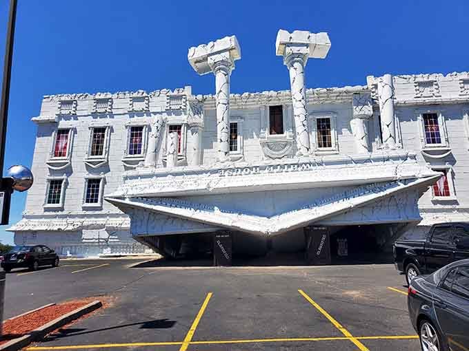 That's not a construction accident, folks. Top Secret's tilting facade is pure, deliberate, glorious chaos.