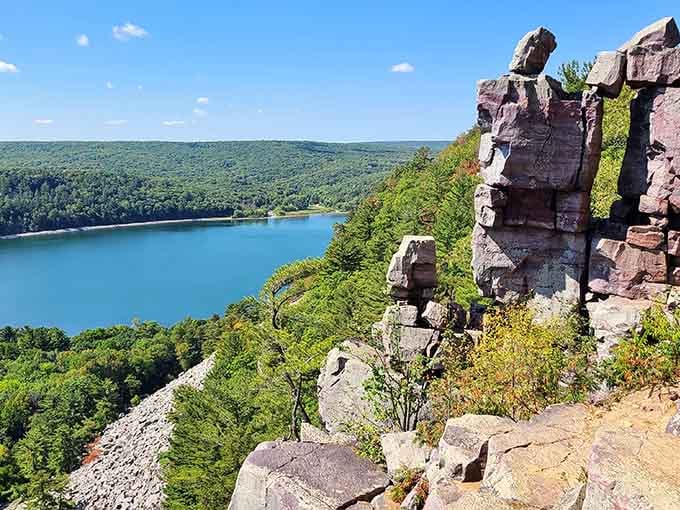 Five hundred feet of pure Wisconsin drama, where the rocks have been holding this view hostage for a billion years.