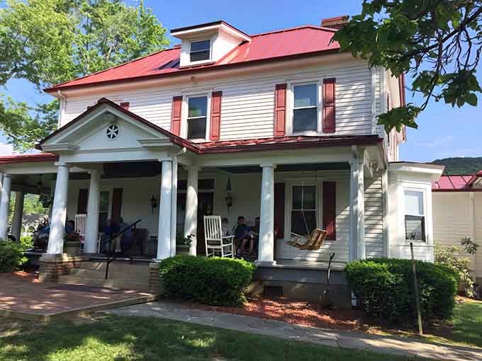 A white farmhouse with a red roof that says "come on in" louder than any neon sign ever could.