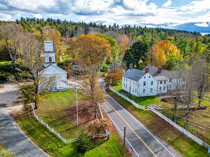One winding road, a white church, golden trees, and zero traffic. Colebrook in fall is basically nature showing off on purpose.