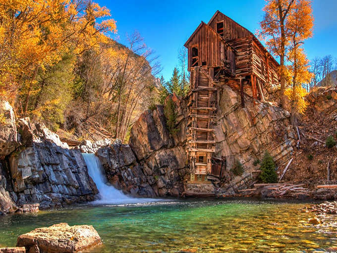 Fall transforms the Crystal Mill into a postcard that makes your actual postcards feel inadequate and slightly embarrassed.