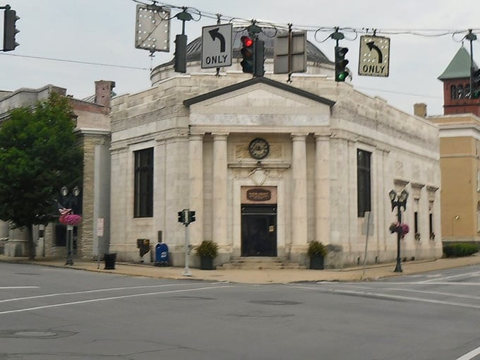 Classical columns meet small-town charm where banking once happened and architecture still matters more than Instagram filters.
