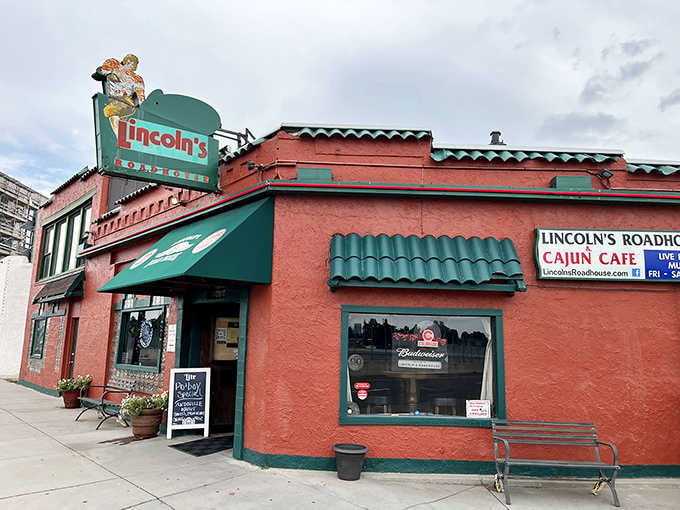 Green awnings, a quirky rooftop figure, and a Cajun Cafe sign that means every word it says.