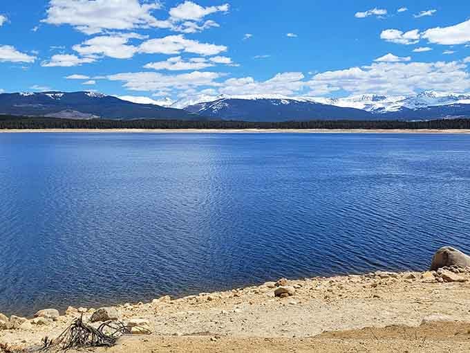 That deep blue water stretching toward snow-dusted peaks is not a screensaver, it's Turquoise Lake in real life.