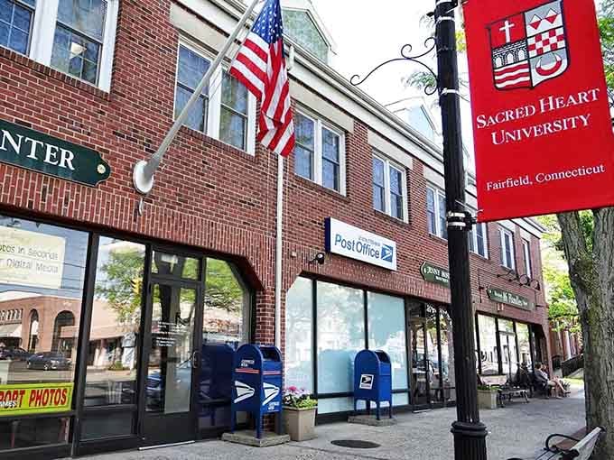 Sacred Heart University's banner stands proud on a classic Fairfield brick streetscape, where history and higher learning share the same sidewalk.
