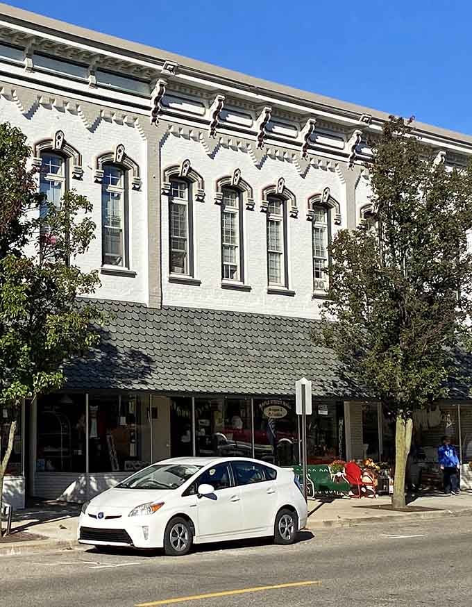 That gorgeous white brick facade isn't just pretty, it's practically whispering, "Come find something wonderful inside."