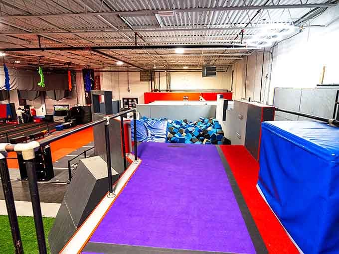 That foam pit in the distance is basically a safety net for ambition, catching failed flips and bruised egos alike.