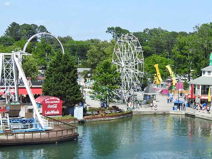 That Ferris wheel rising above the lake says everything you need to know about this place, pure classic joy.