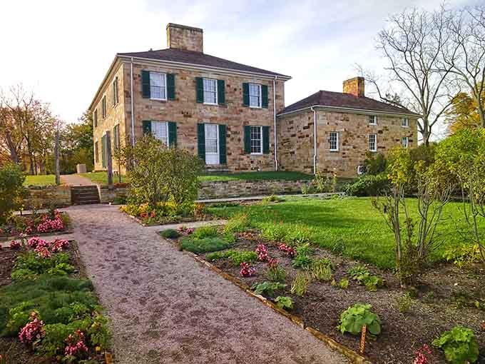 Golden sandstone walls and lush garden beds make this autumn arrival at Adena Mansion genuinely unforgettable.