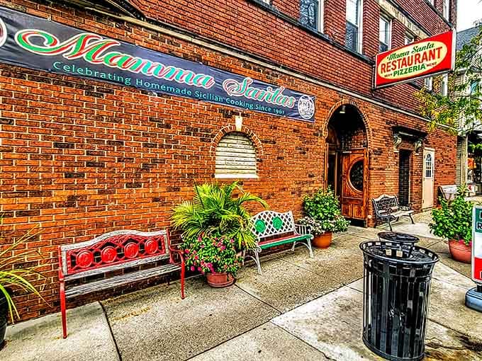 Colorful benches, potted plants, and warm brick walls make Mama Santa's entrance feel like a Little Italy postcard come to life.