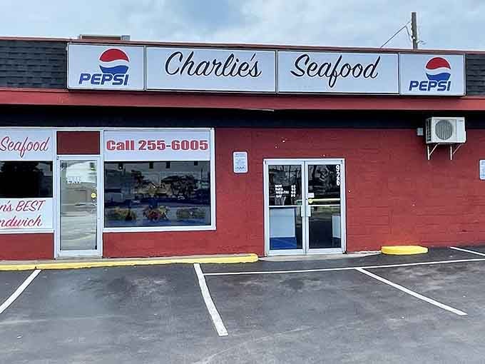 That bold red exterior and hand-painted phone number say everything: no fuss, just seriously good seafood waiting inside.