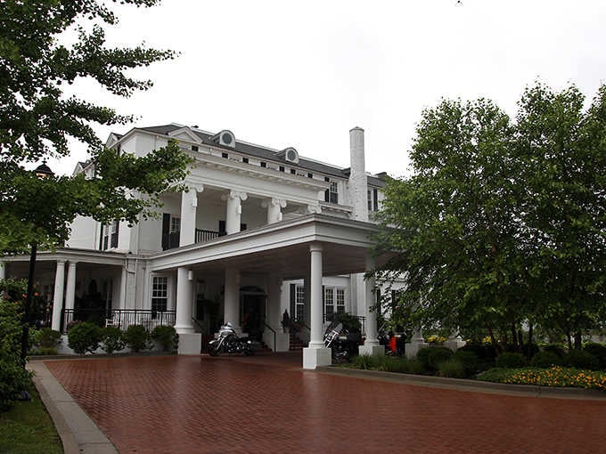 That grand white facade isn't just a building, it's a century of Kentucky hospitality standing at attention.