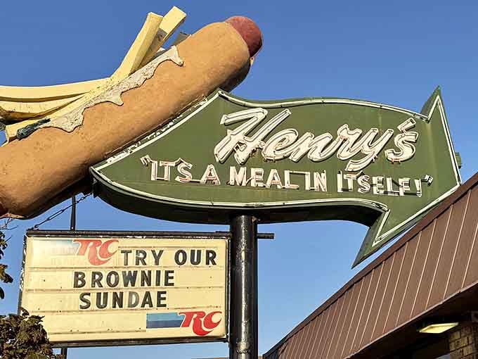 That giant fiberglass hot dog perched on the sign isn't just decor, it's a delicious promise Henry's has been keeping for decades.