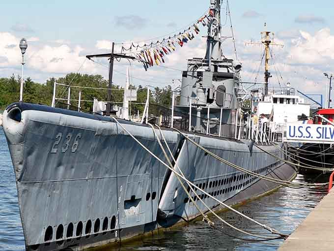 Colorful signal flags dress up hull 236 like it's celebrating, but this warship's record speaks louder than any decoration.