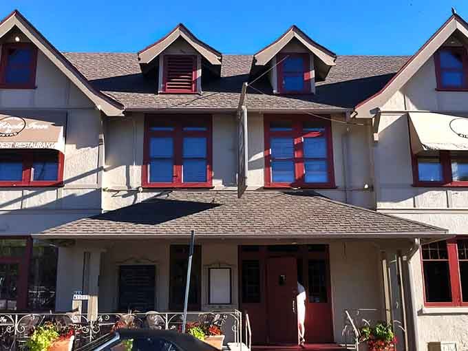 That red-trimmed exterior isn't just charming, it's practically winking at you from across the street.