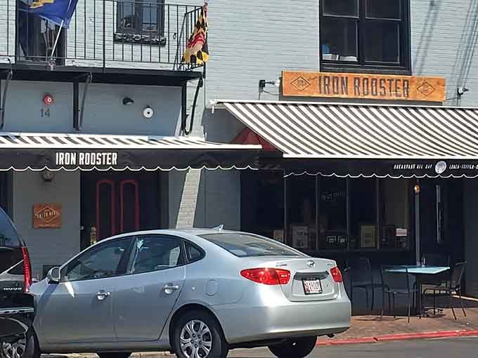 That striped awning beckons like a lighthouse for the hungry, promising comfort food adventures in charming downtown Annapolis.