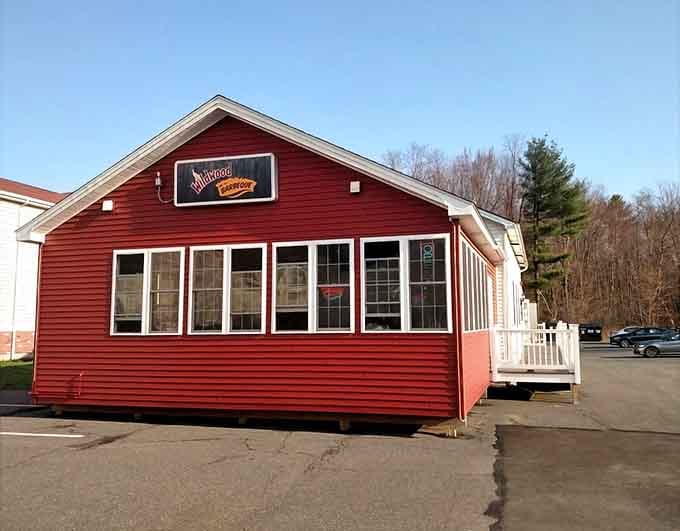 That red barn exterior is hiding some serious smoky secrets inside, and your taste buds are about to find out.