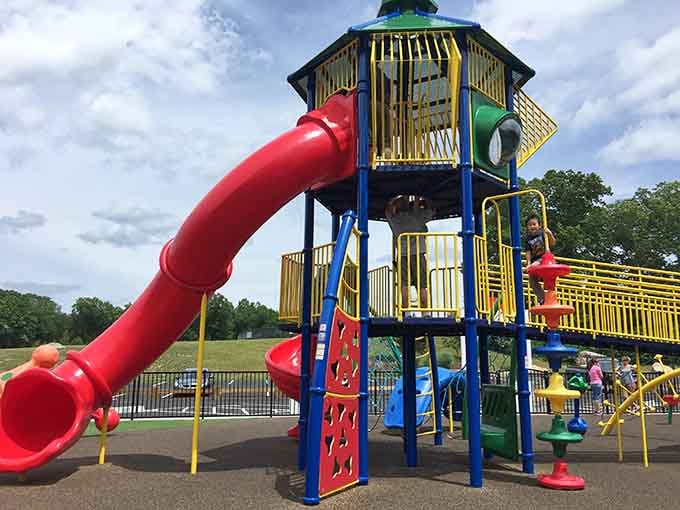 That red tube slide isn't just a slide. It's a one-way ticket back to the best parts of childhood.