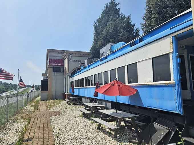 That blue train car isn't lost, it's exactly where it belongs, serving hungry travelers since forever.