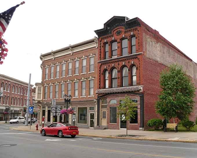 Victorian brick buildings stand tall like proud grandparents, their ornate details whispering stories of industrial glory days.