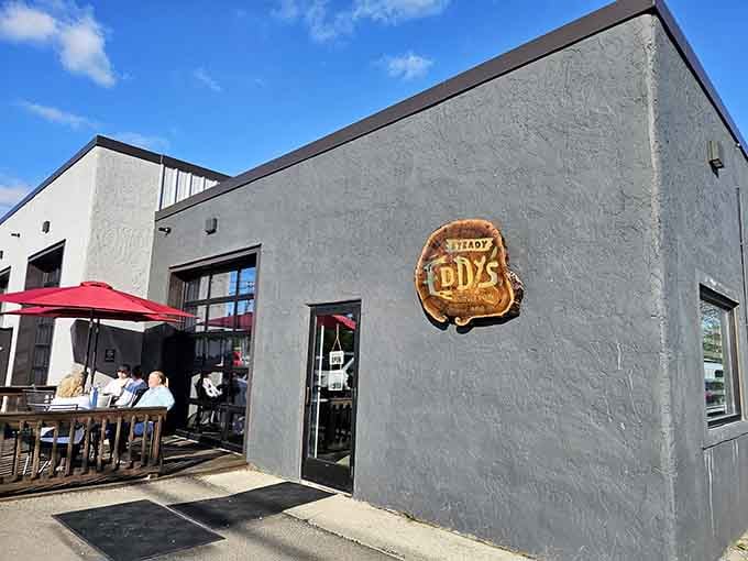 That gray exterior might look understated, but inside awaits pizza, paddles, and pure Indiana adventure magic.