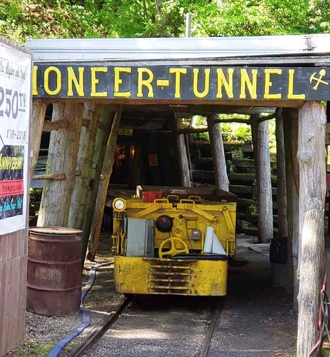 That bold yellow mine car isn't just sitting there looking pretty, it's your chariot into the earth's depths.