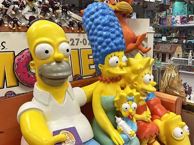 Homer, Marge, and the kids frozen in time, surrounded by decades of cartoon history that would make any fan emotional.