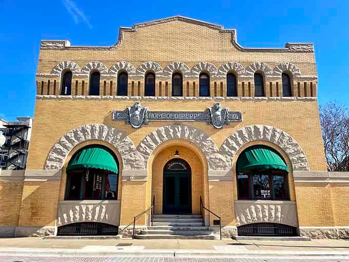 That gorgeous yellow brick facade isn't just pretty, it's been whispering "Home of Dr Pepper" since the 1800s.