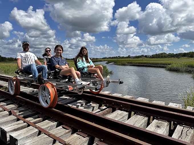 Four smiling riders glide over a trestle bridge, proving New Jersey's backyard is absolutely stunning.