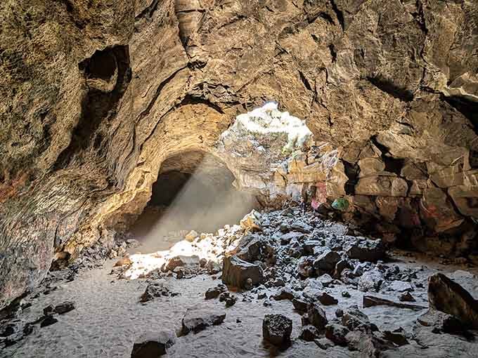 The entrance to Pluto's Cave looks like nature's own secret doorway to another world beneath your feet.