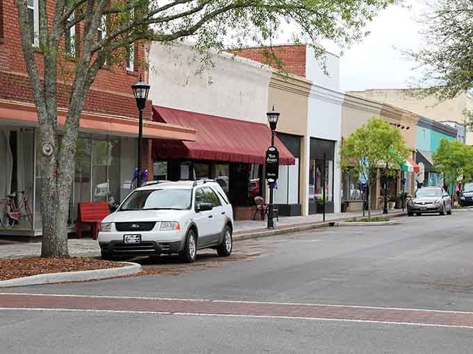 Brick storefronts, gas lamp posts, and a red awning that practically begs you to slow down and browse.