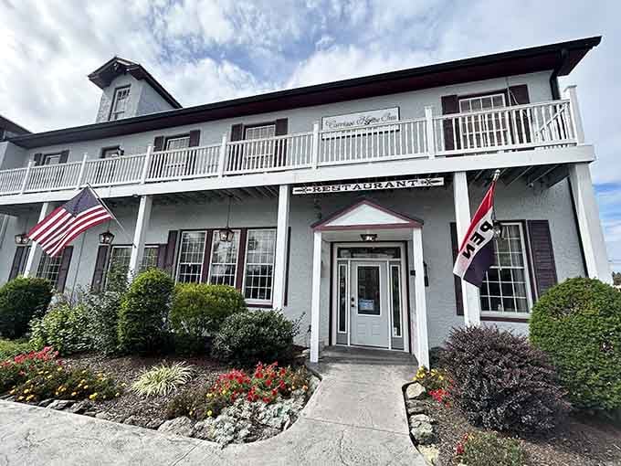 This charming white building with its welcoming balcony practically begs you to come inside and stay awhile.