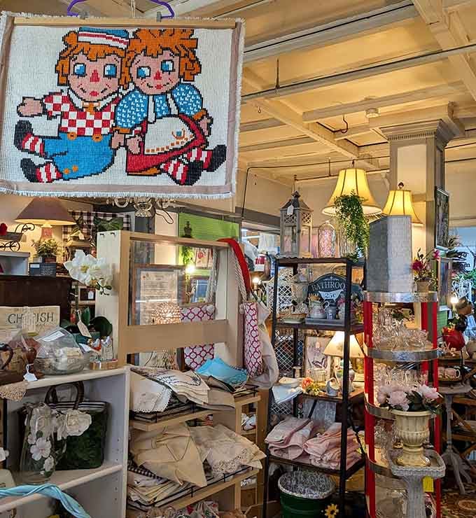 A charming Raggedy Ann needlepoint piece watches over a cozy collection of home d&eacute;cor treasures that are just too good to pass up!