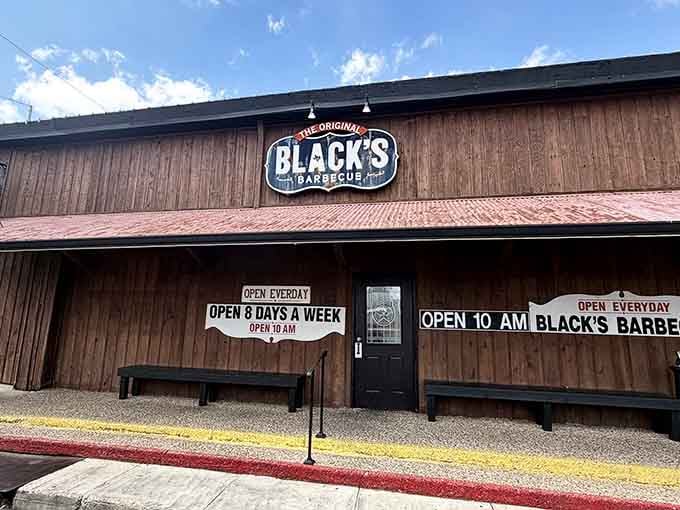 That "Open 8 Days a Week" sign isn't a typo, it's a bold statement from a place that takes barbecue very seriously.