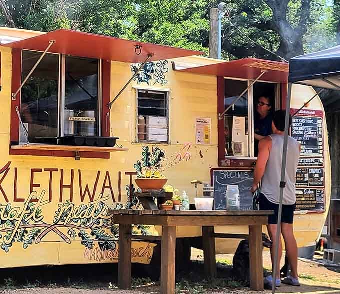 That cheerful yellow trailer isn't just serving lunch, it's serving up Austin's most talked-about barbecue pilgrimage destination.