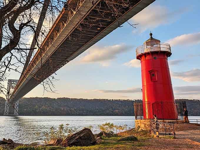 That bold red tower has been standing its ground on the Hudson for over a century, unbothered and magnificent.