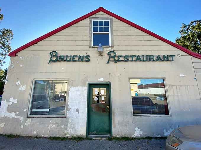 That green door and hand-lettered sign are practically whispering, "Come in, something delicious is waiting."