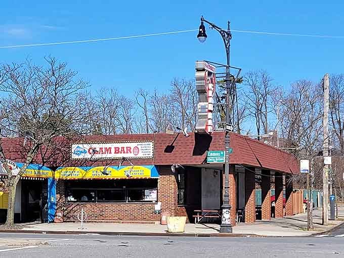 That colorful corner sign on Emmons Avenue is basically Brooklyn's way of saying, "Hey, pay attention here."