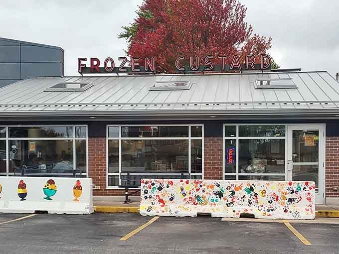 Those painted concrete barriers out front aren't just decoration. They're a community scrapbook in handprints.