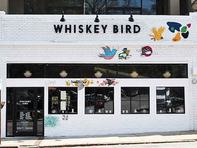 Whiskey Bird's white brick exterior and colorful murals signal something delicious is happening inside.