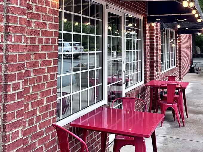 Red chairs, brick walls, and the promise of unforgettable steaks make this your next dinner destination.
