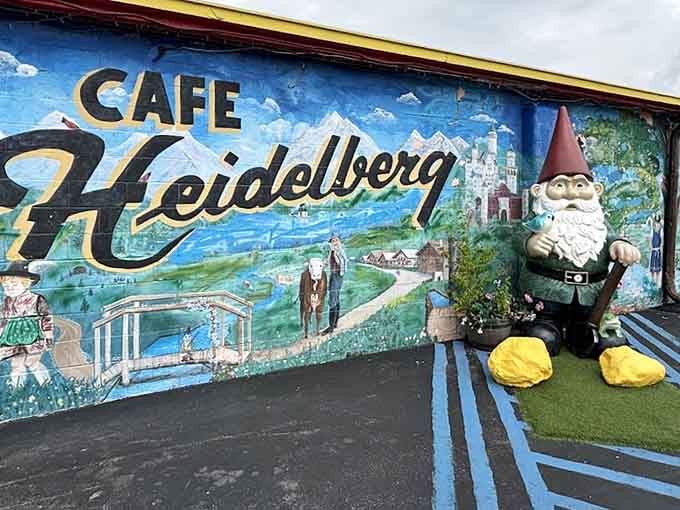 The "Cafe Heidelberg" mural stretches wide, painted with mountains, castles, and pure Bavarian pride.