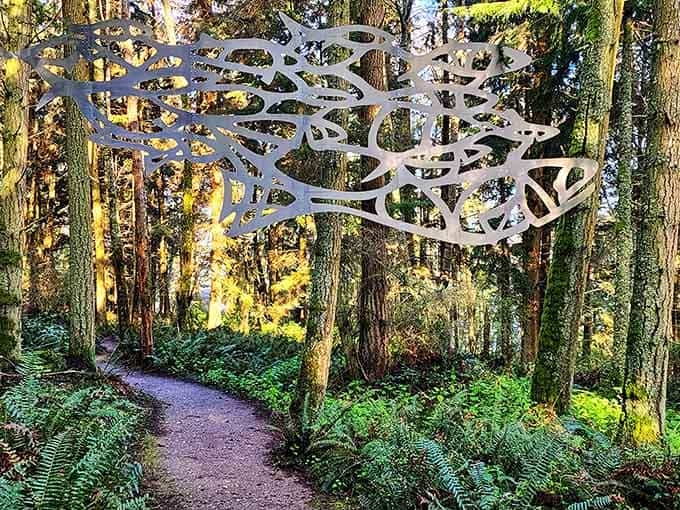 A metal school of fish floats through ancient trees at Price Sculpture Forest, Coupeville's most magical surprise.