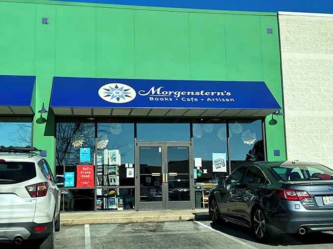 That cheerful blue awning is basically a welcome hug from Bloomington's most beloved bookstore café.