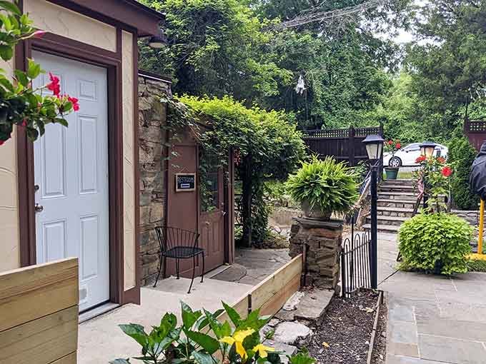 Stone walls, climbing ivy, and red blooms greet you like a storybook come to life at Old Angler's Inn.